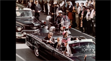 The Kennedys' motorcade drives through downtown Dallas Nov. 22, 1963 ...