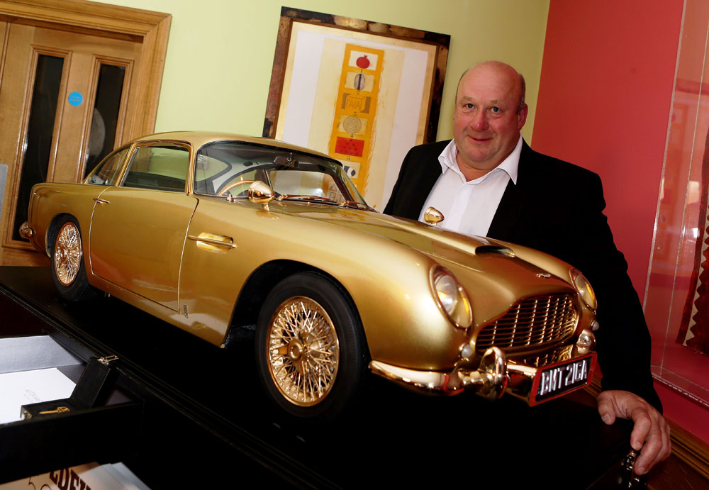 Gold replica of James Bond’s iconic Aston Martin DB5 sold for £55,000 ...